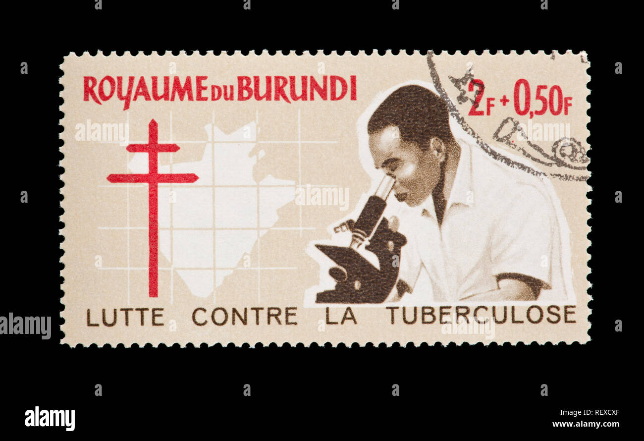 Semi postal stamp from Burundi depicting a scientist with a microscope ...