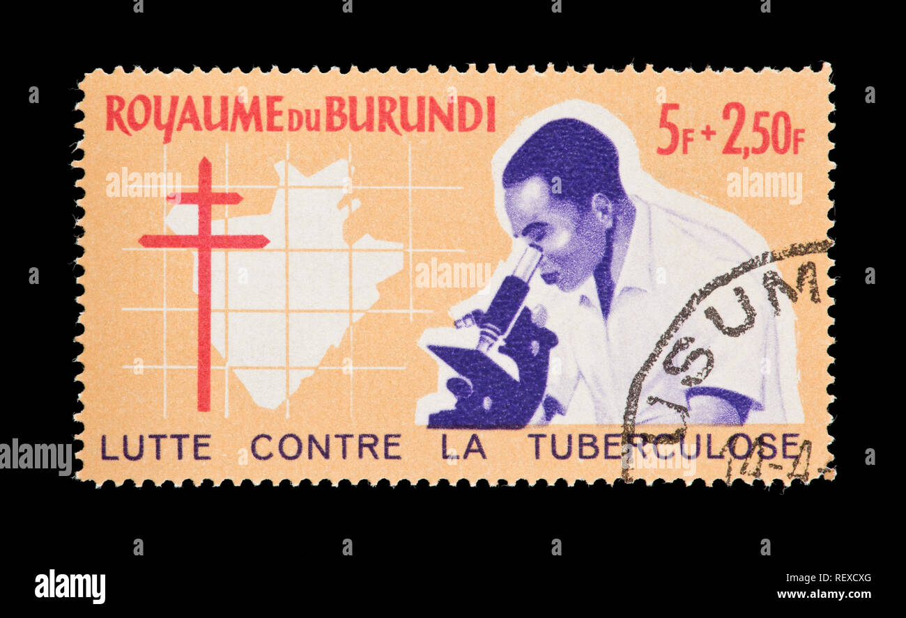 Semi postal stamp from Burundi depicting a scientist with a microscope ...