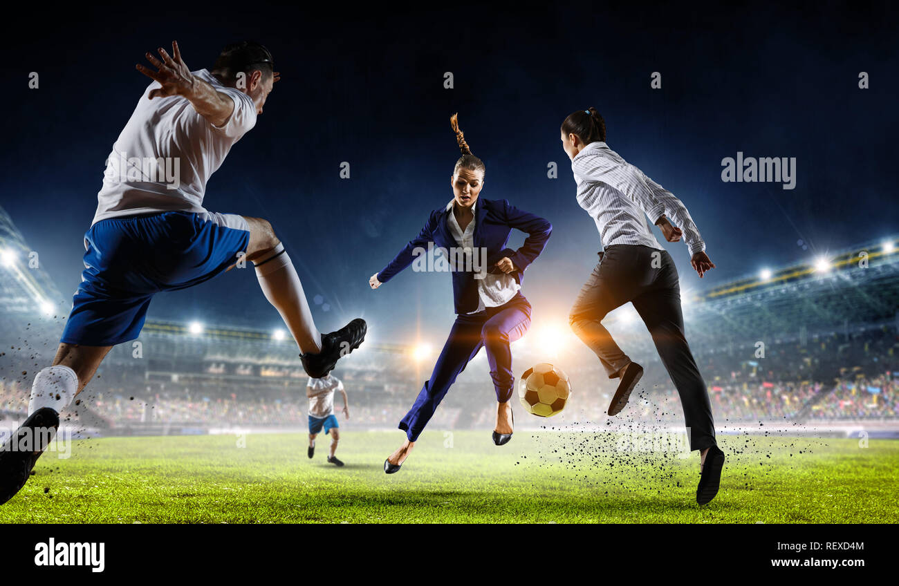 Playing team games. Mixed media Stock Photo - Alamy