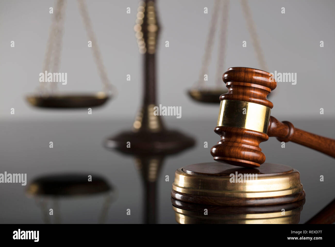 Law concept. Judge's gavel and scale on gray background Stock Photo - Alamy