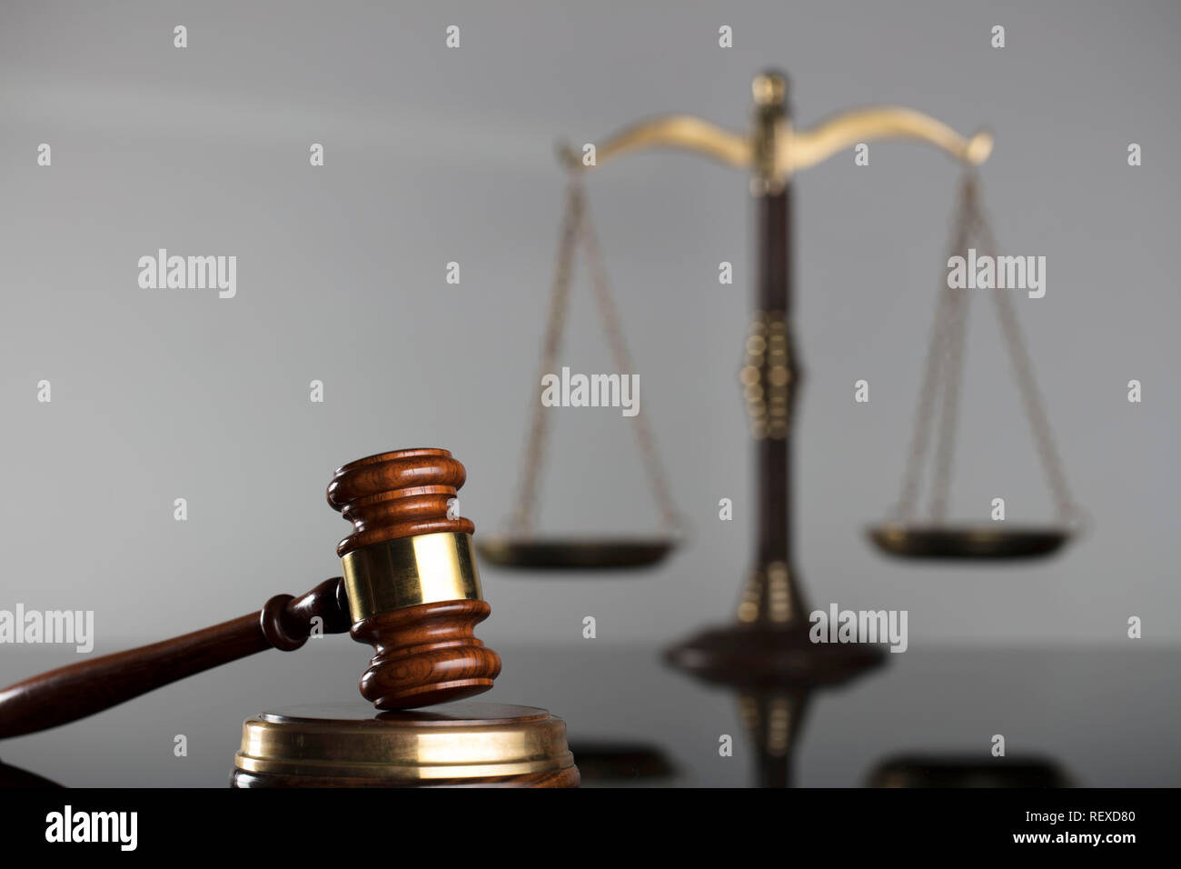 Law concept. Judge's gavel and scale on gray background Stock Photo - Alamy