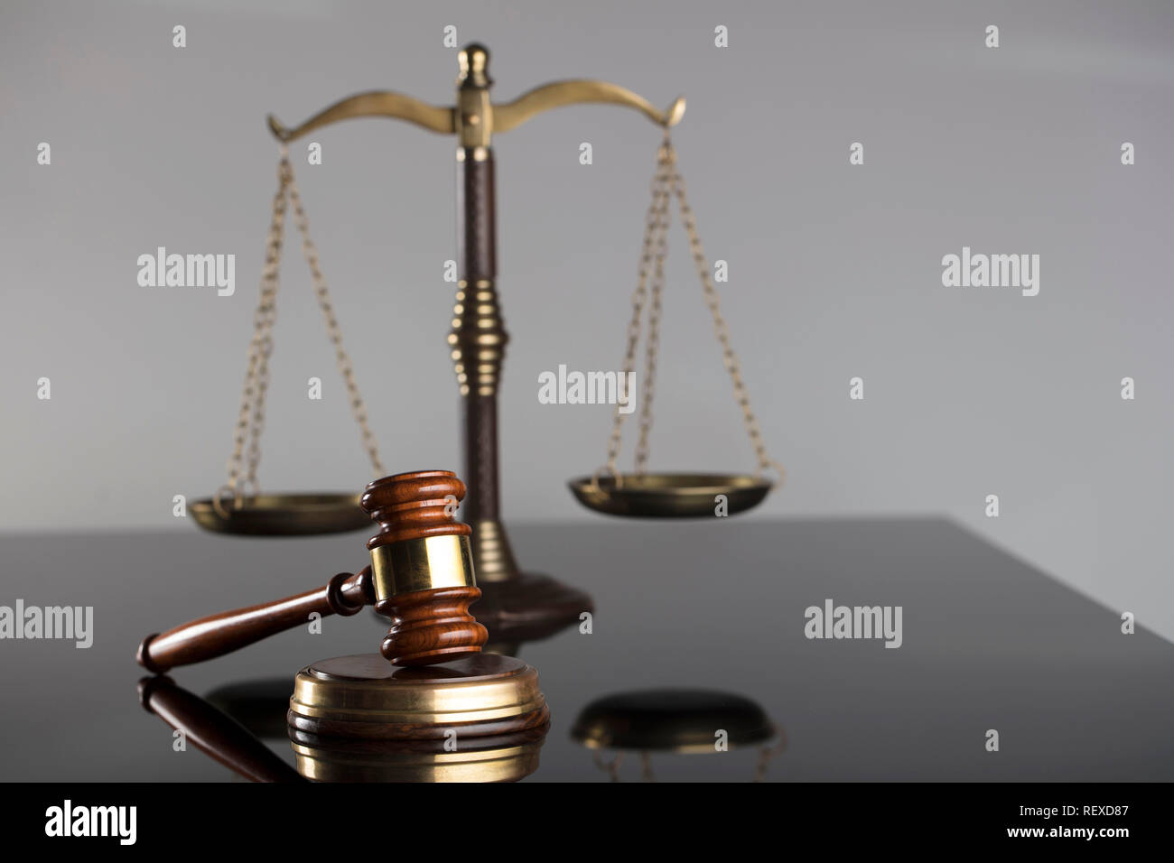 Law concept. Judge's gavel and scale on gray background Stock Photo - Alamy
