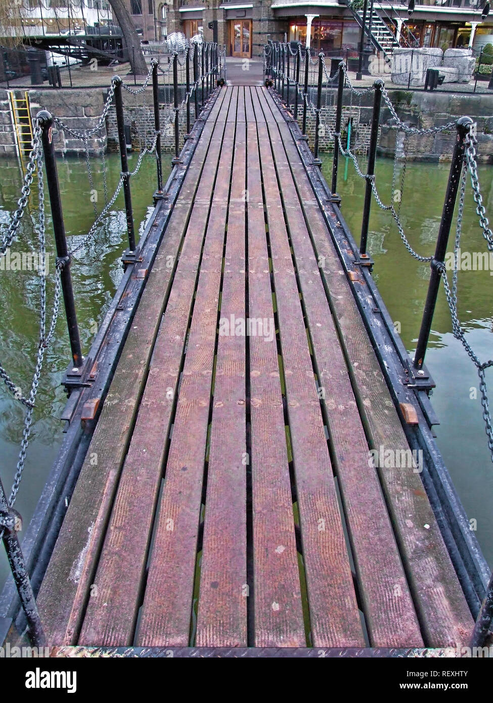 Footbridge over canal water for pedestrian crossing Stock Photo - Alamy