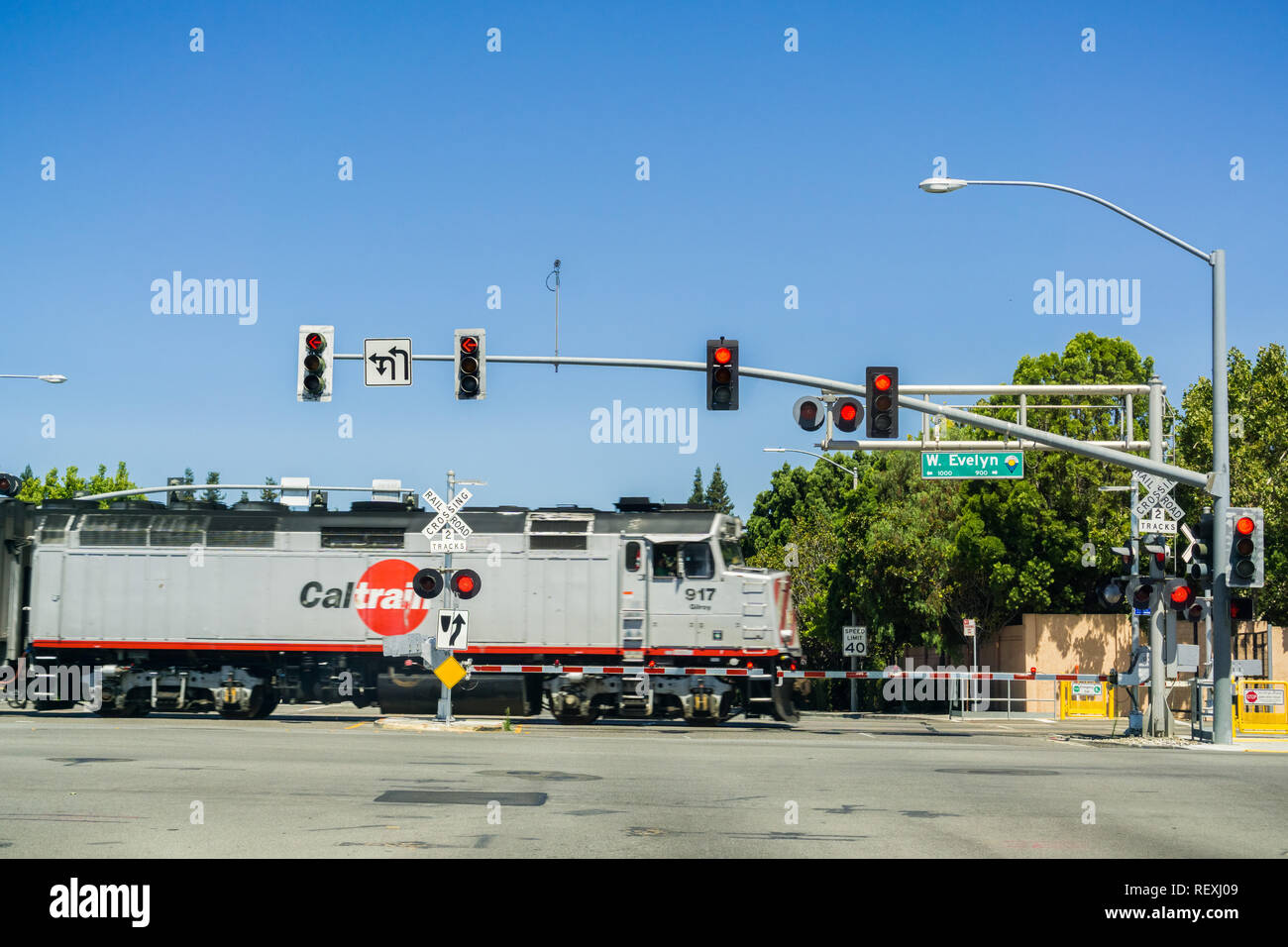 August 30, 2017 Sunnyvale/CA/USA - Caltrain crossing at a street ...