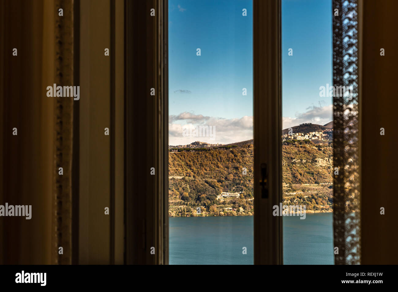 view of blue waters of Italian lake through window Stock Photo - Alamy