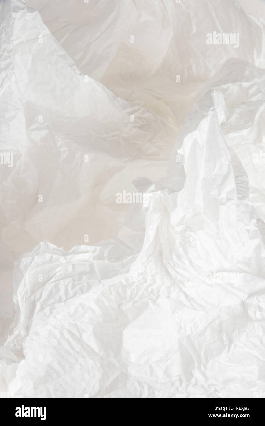 A crumpled piece of white thin packaging paper Stock Photo - Alamy