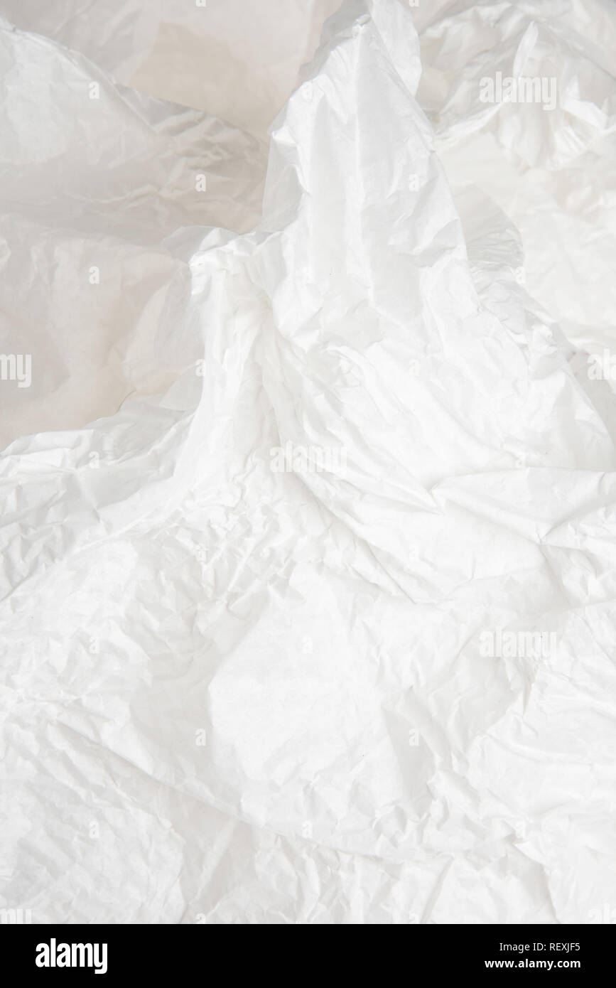 A crumpled piece of white thin packaging paper Stock Photo - Alamy