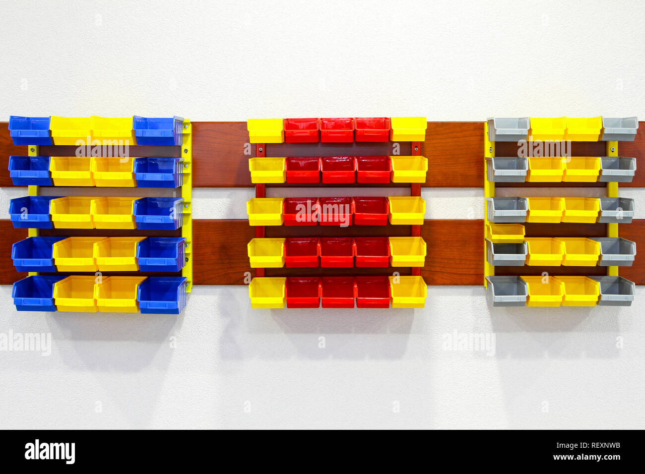 Open plastic boxes wall shelves in storehouse Stock Photo - Alamy