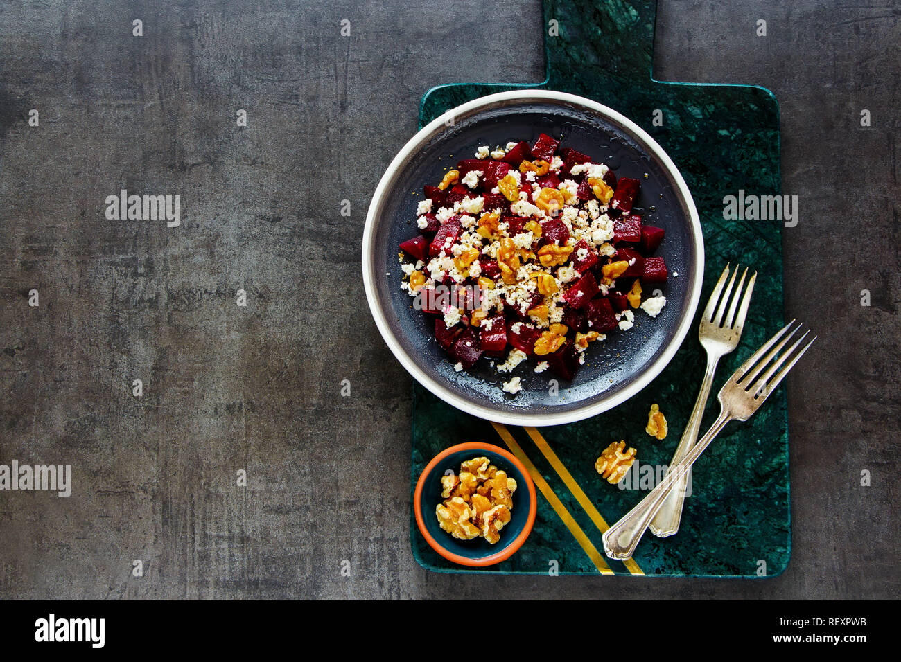 Flat-lay of salad with roasted beetroot, walnut and feta cheese Stock ...