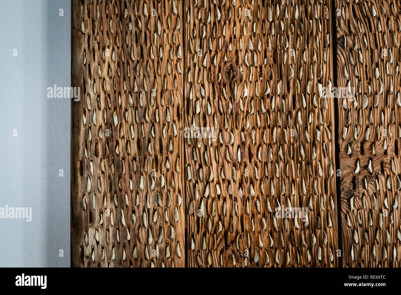 Textured background of nice wall composed of perforated lumber panels ...