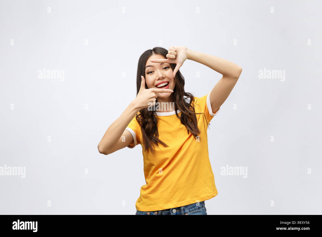 young asian woman hands making frame gesture on grey background Stock ...