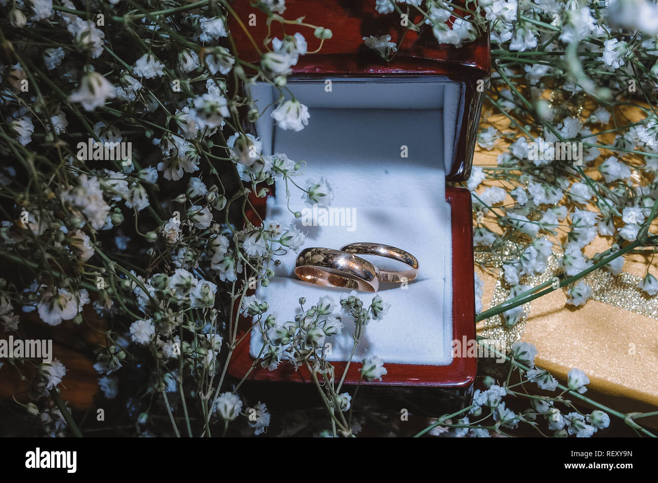 Wedding ring in floral background Stock Photo - Alamy