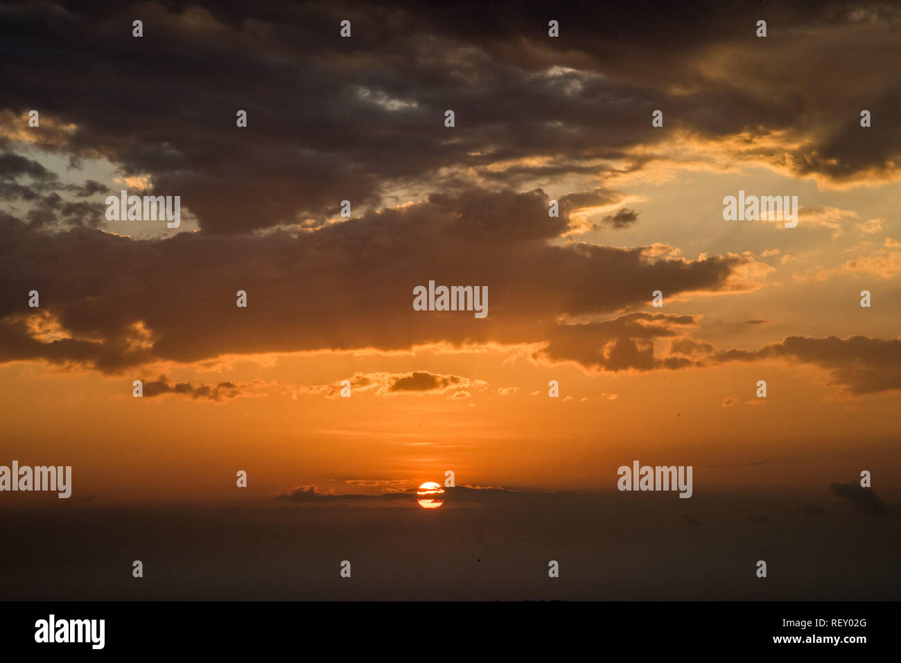 Sunset sky with an orange glow and clouds in tropical Darwin, Australia ...