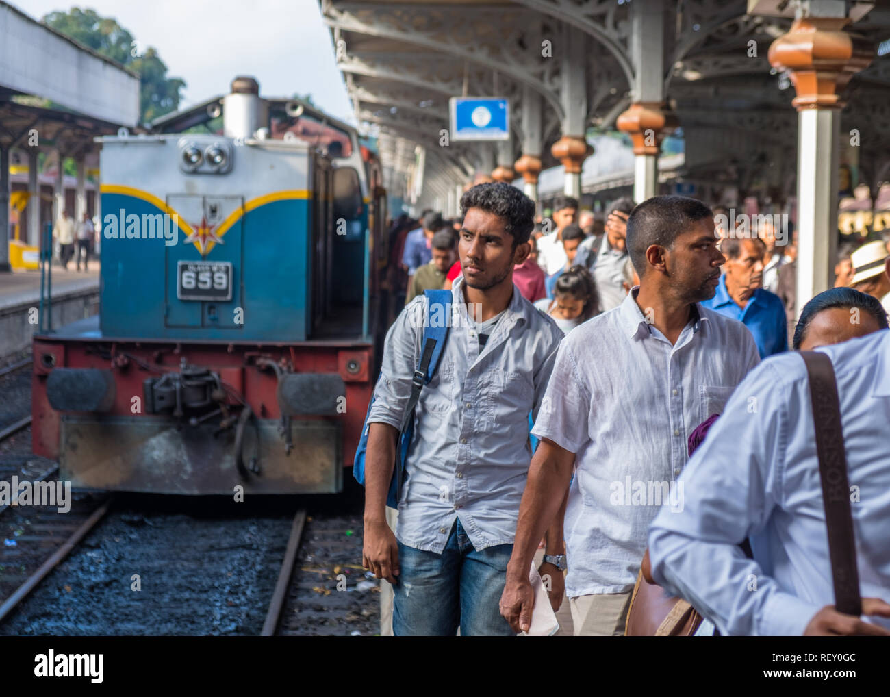 Kandy Train station, Sri Lanka, . Large group of commuters come out of ...