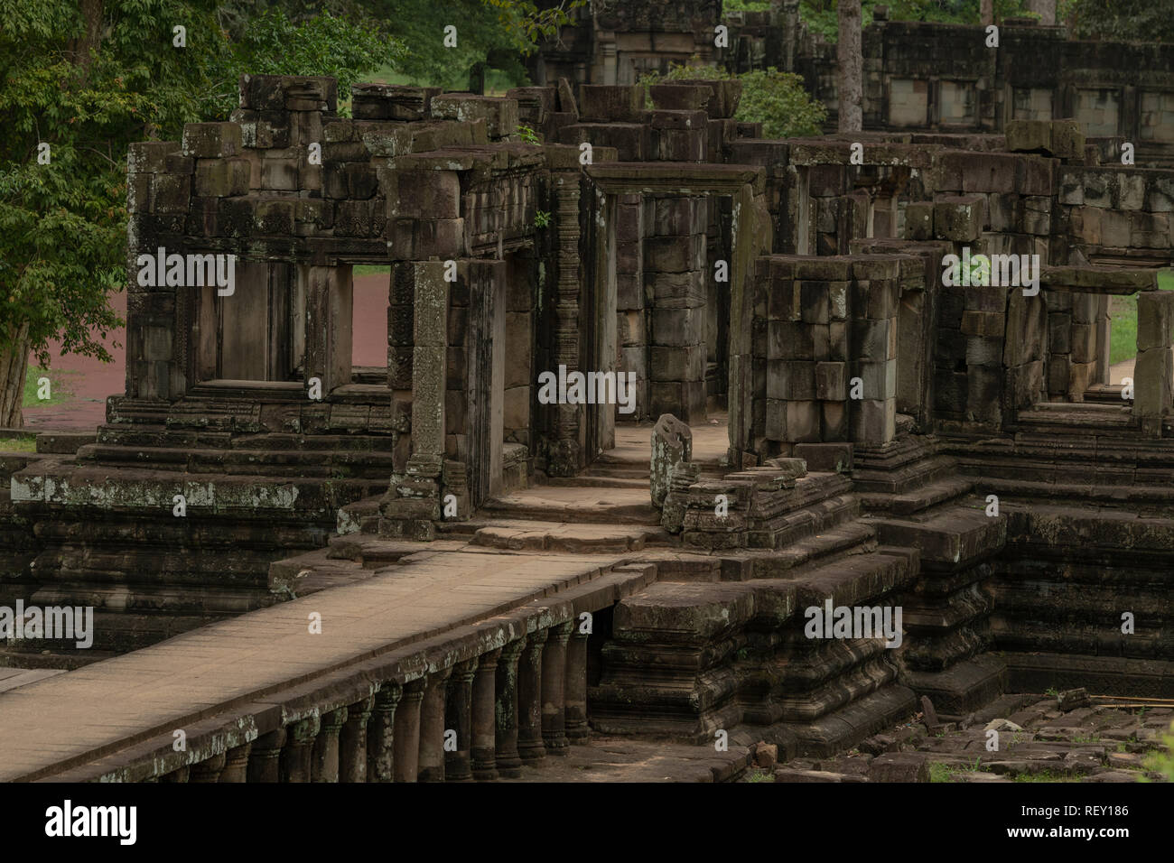 Stone causeway leads to Baphuon temple ruins Stock Photo - Alamy