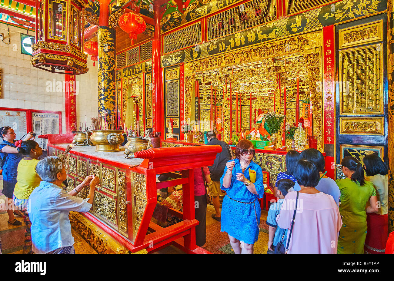 YANGON, MYANMAR - FEBRUARY 17, 2018: The numerous devotees at the ...