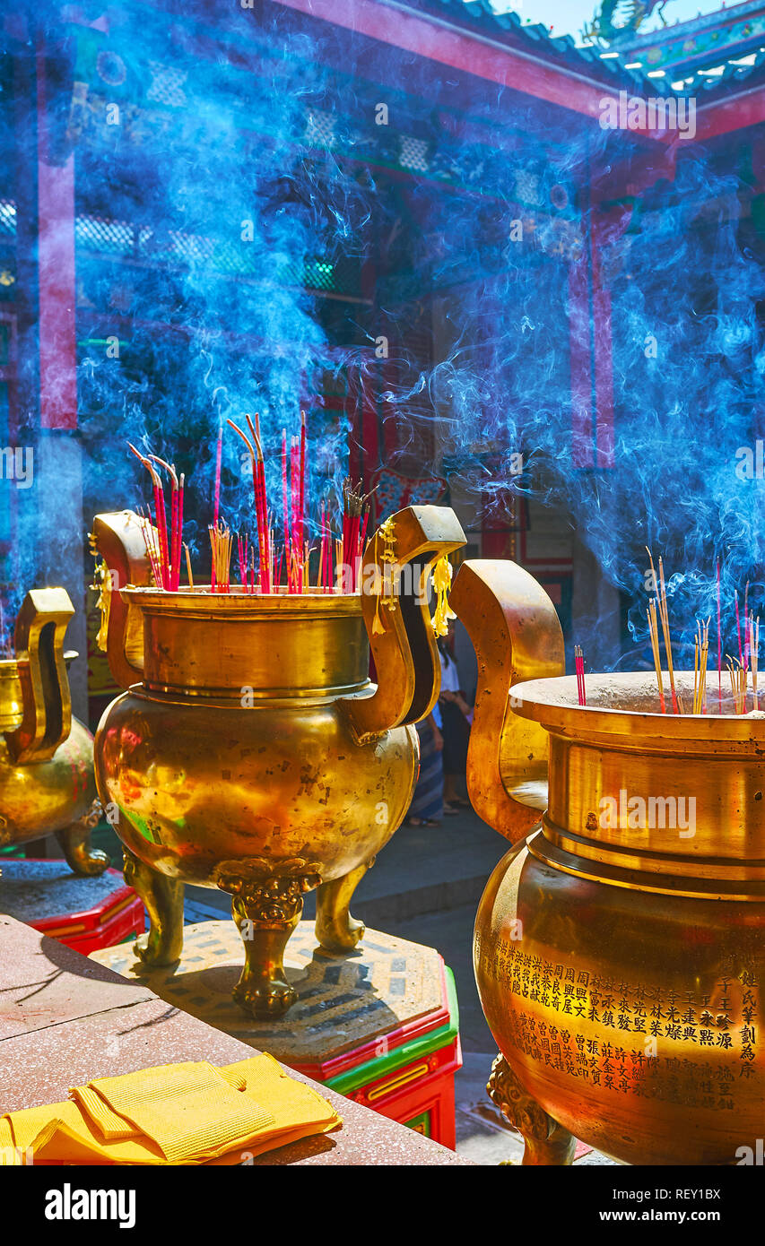 YANGON, MYANMAR - FEBRUARY 17, 2018: Thick smoke rises above the large ...