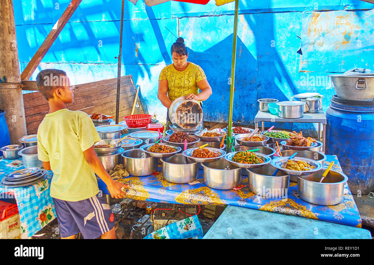YANGON, MYANMAR - FEBRUARY 17, 2018: Chinatown street food cafe at the ...
