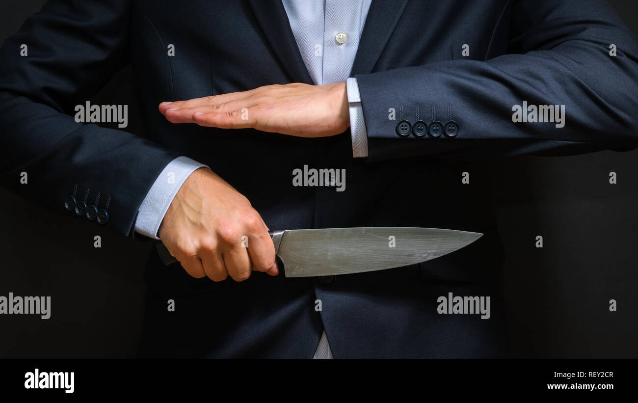 Criminal with big knife hidden. Cold weapon, burglary, homicide, murder ...