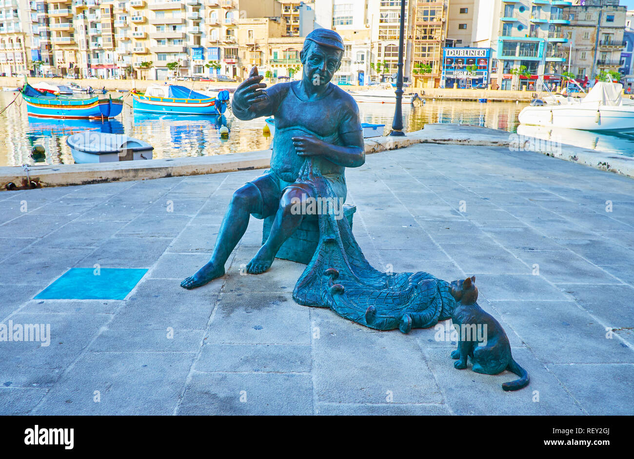 ST JULIANS, MALTA - JUNE 20, 2018: The bronze statue of old fisherman ...