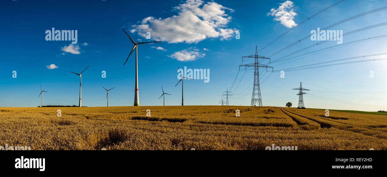 Panoramic view of some wind power plants and a high-voltage powerline ...
