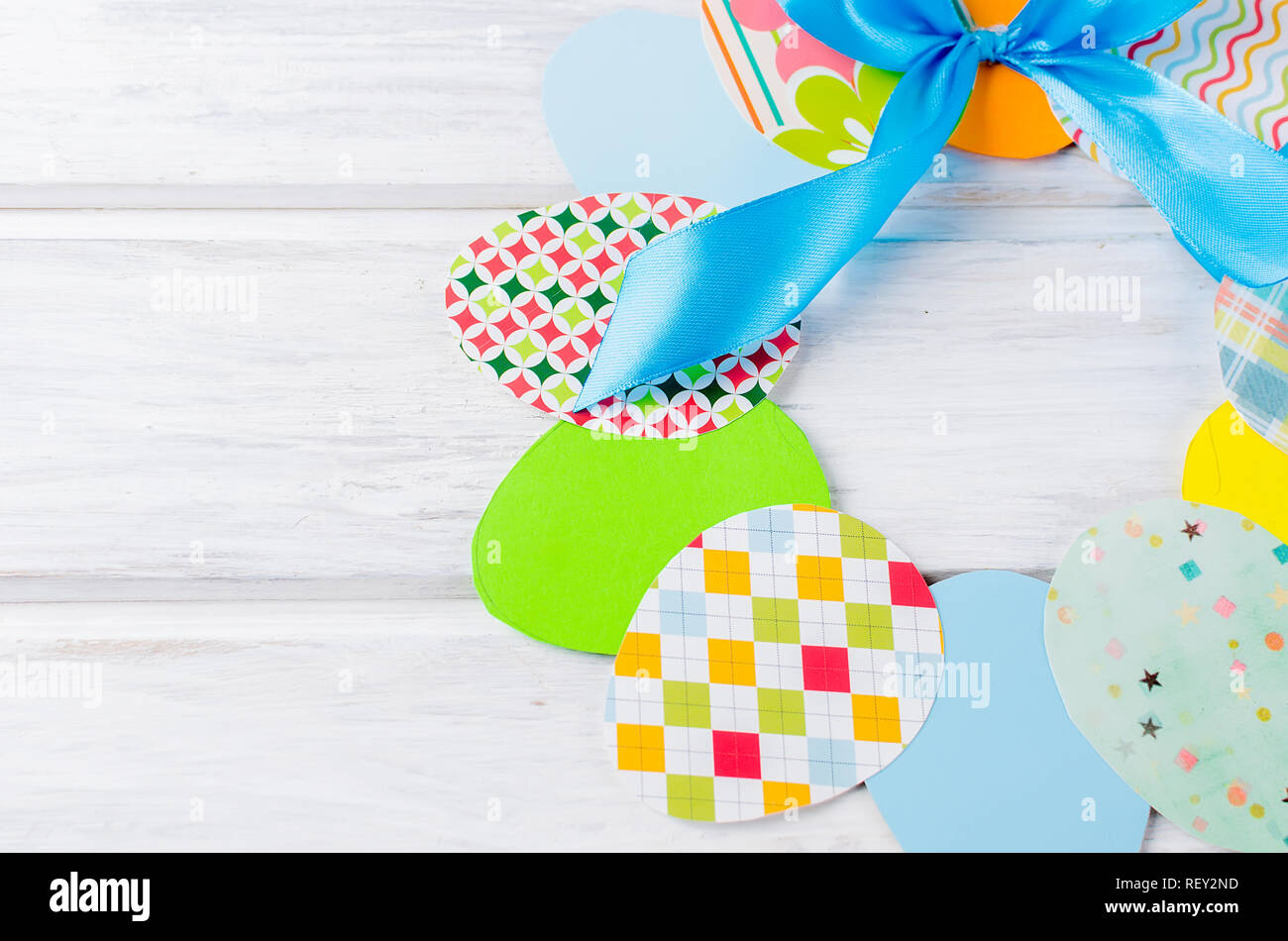 craft of paper in the form of a wreath of colorful paper eggs on white ...