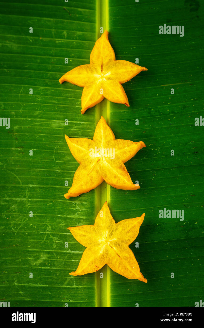 Three Slices of ripe yellow star fruit carambola or star apple ...