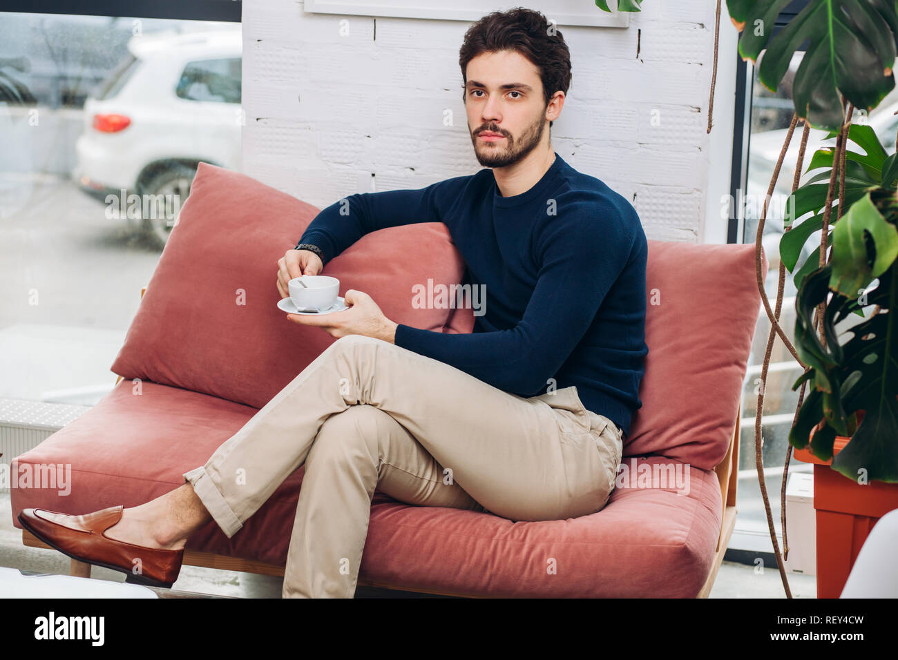 awesome serious guy with a cup of tea Stock Photo - Alamy