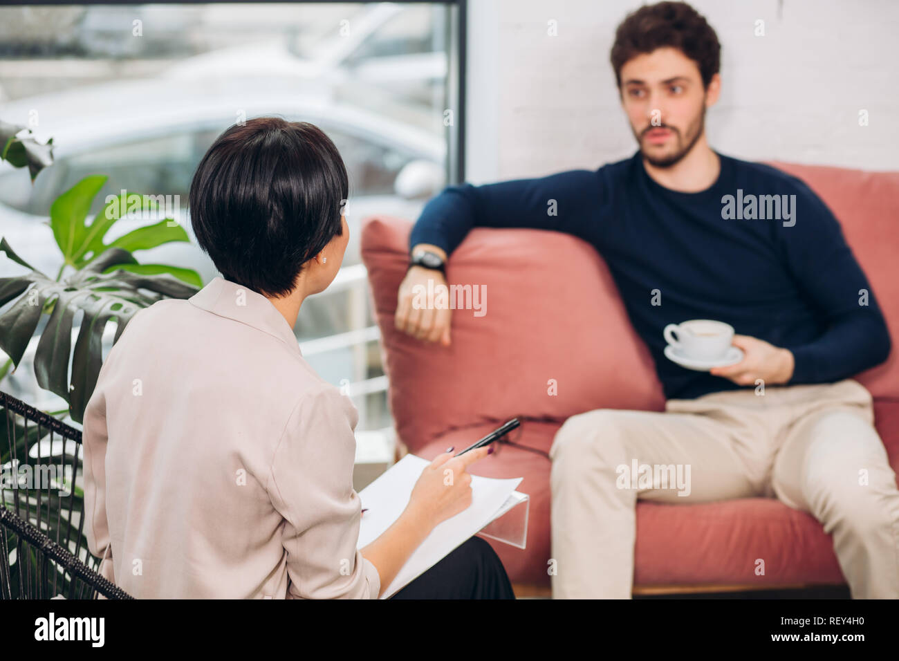 bank worker consulting a handsome man in the office Stock Photo - Alamy