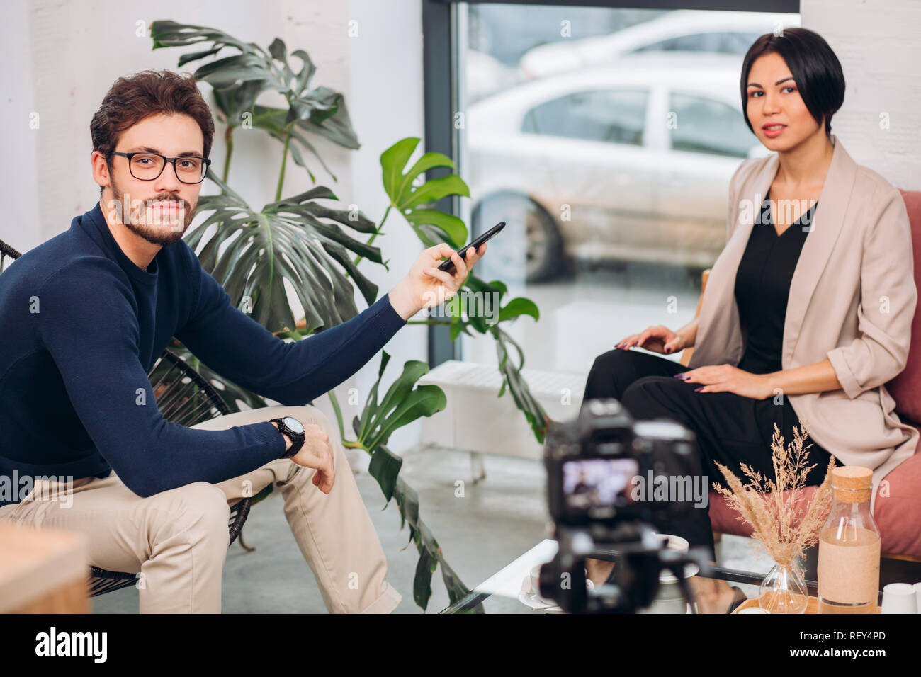 man is fixing up an interview with a famous talented writer Stock Photo ...