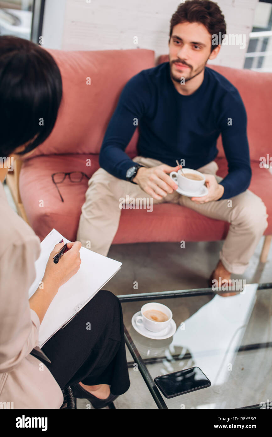 job interview. handsome beraded man having a consultation with a ...