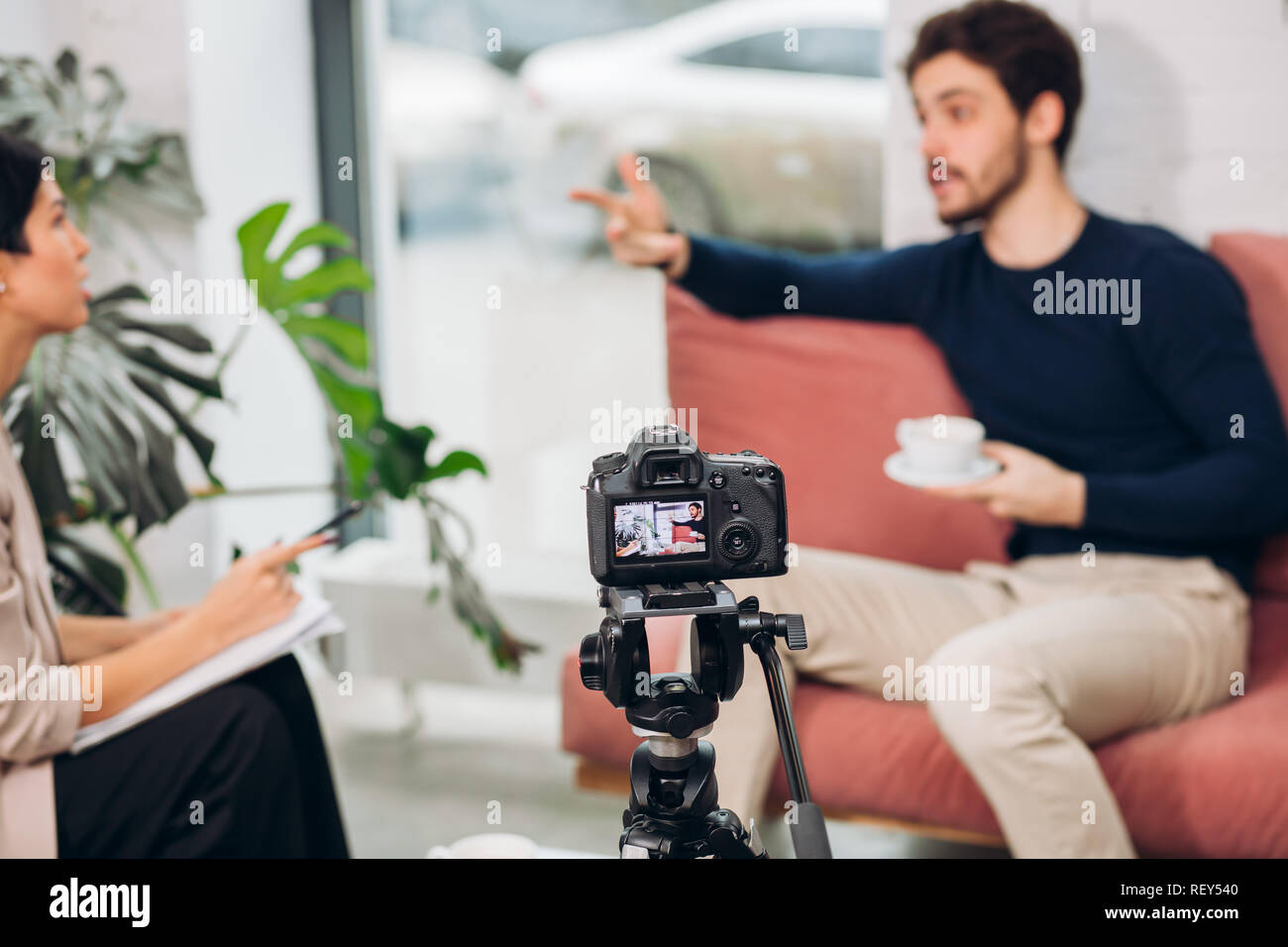 conflict between a journalist and a celebrity during online show Stock ...