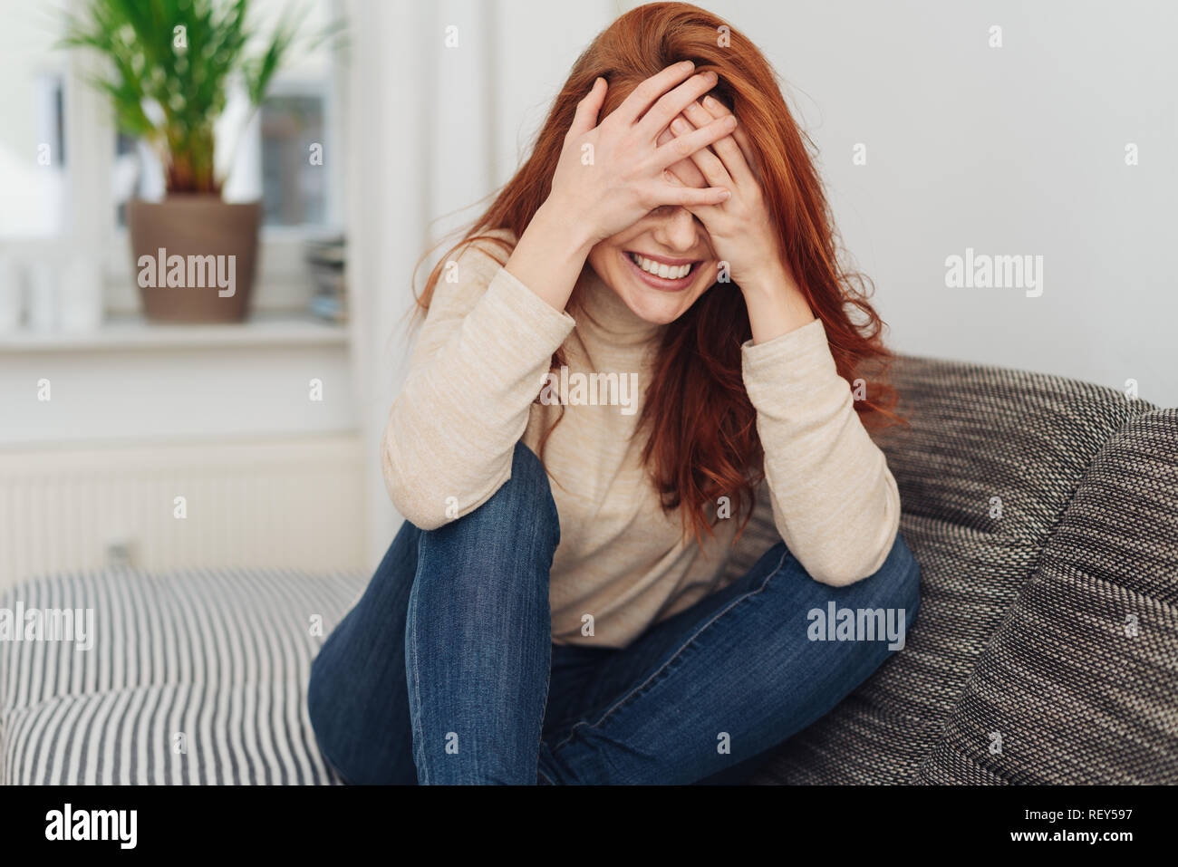 Hiding behind sofa hi-res stock photography and images - Alamy
