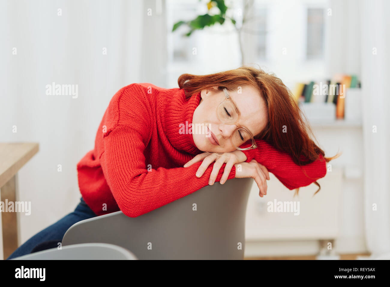 Leaning over chair hi-res stock photography and images - Alamy