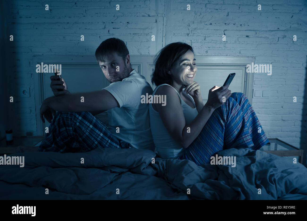 Lifestyle portrait of happy girlfriend wife addicted to mobile phone in ...