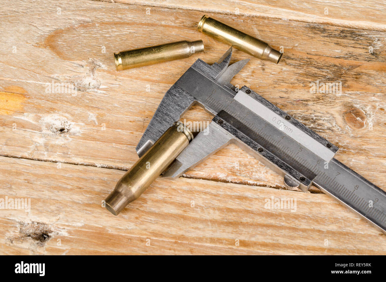 Bullet being measured with a caliper, a concept Stock Photo - Alamy