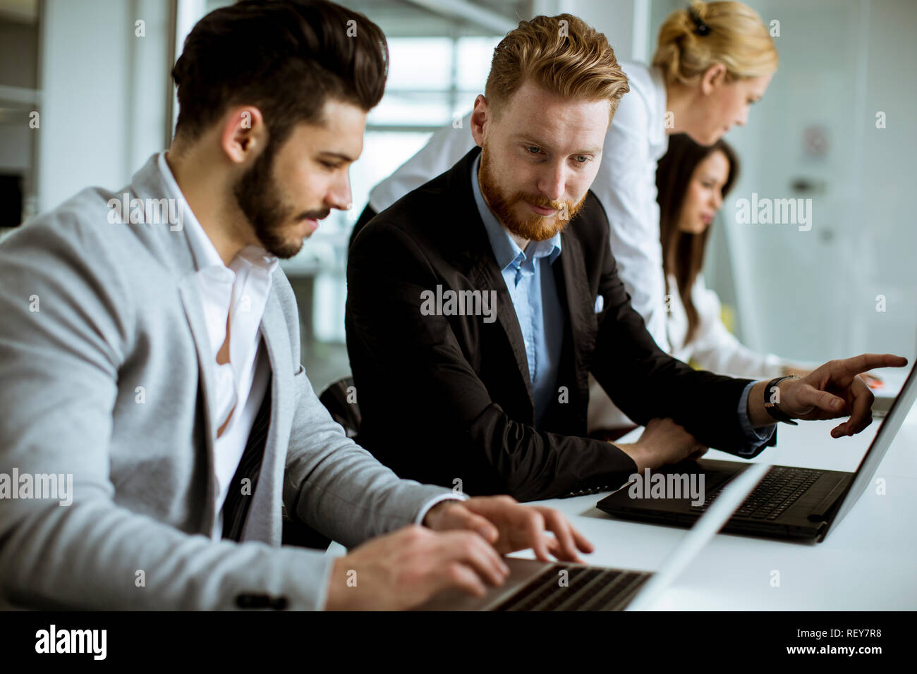 Team businessmen sharing ideas hi-res stock photography and images - Alamy