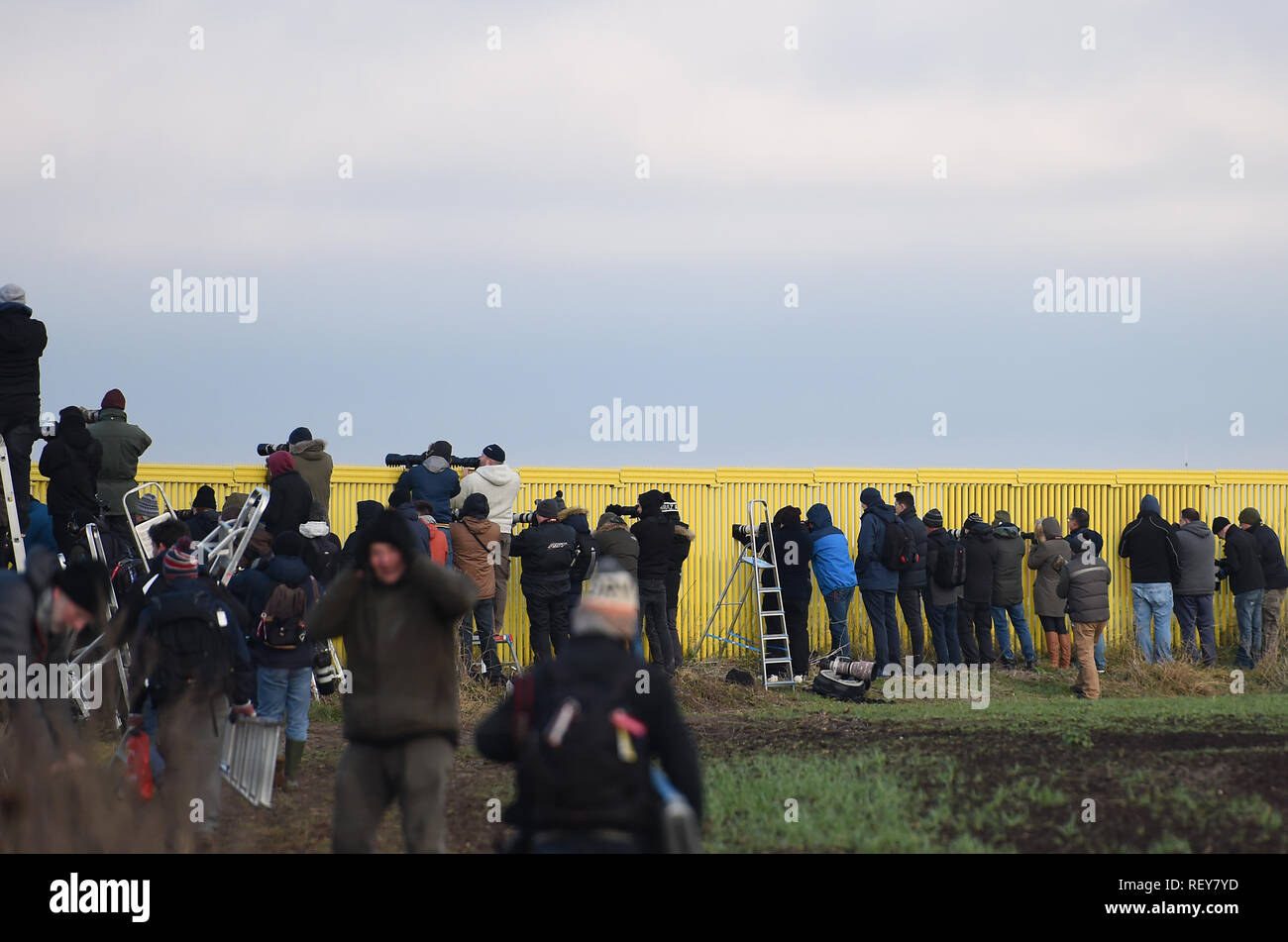 Plane enthusiasts line the perimeter fence at RAF Marham in Norfolk to ...