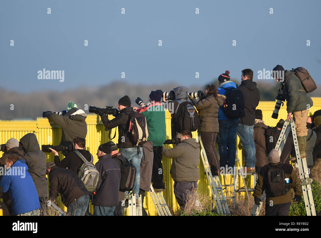 Plane enthusiasts line the perimeter fence at RAF Marham in Norfolk to ...