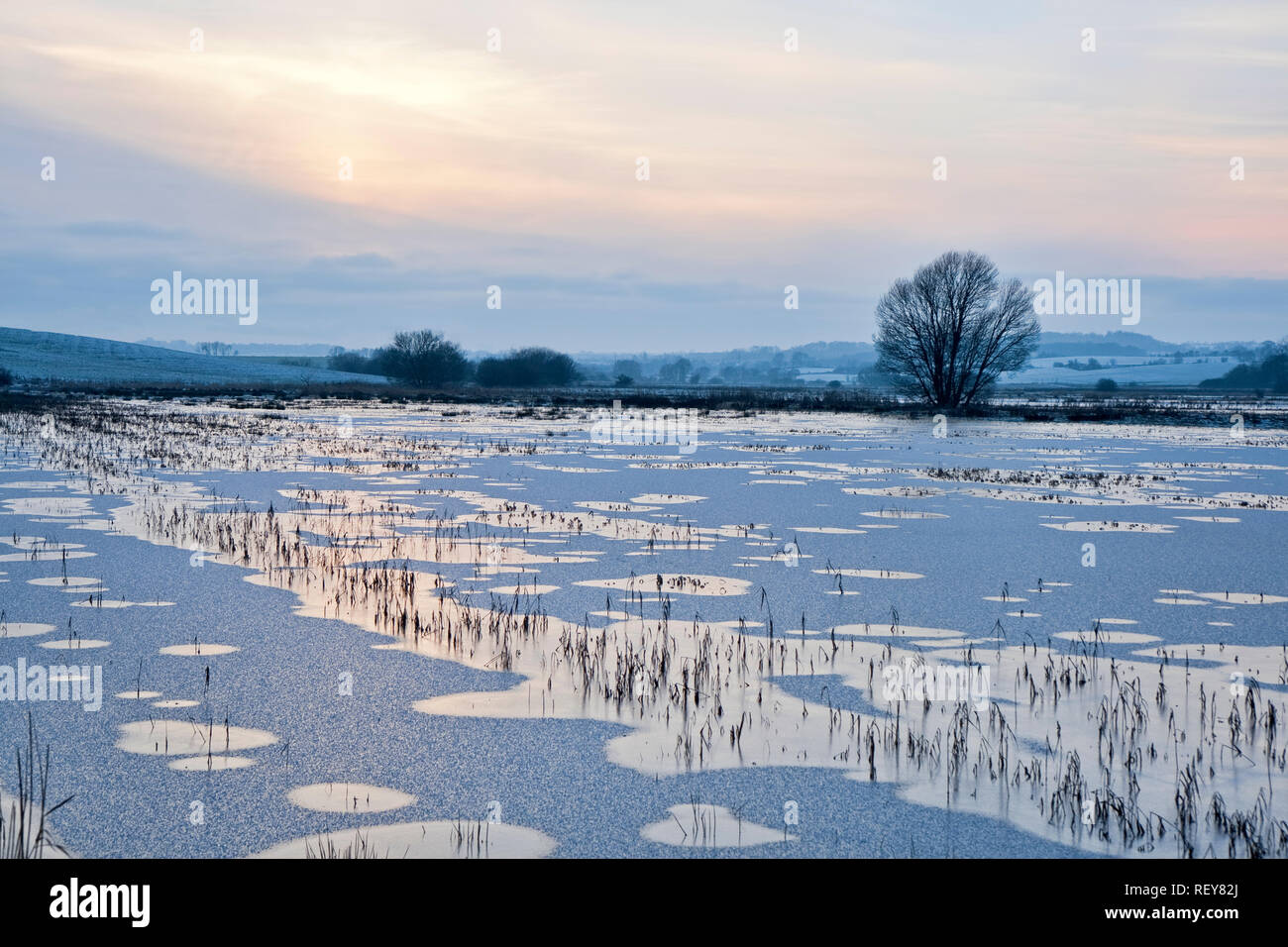 Frozen lake at sunset. Can be used as background Stock Photo - Alamy