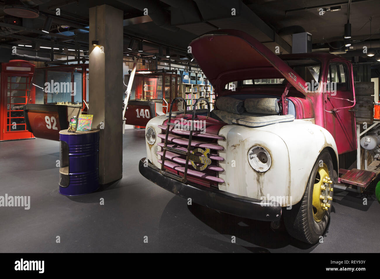 White and red Volvo truck containing seating in front and kitchen at ...