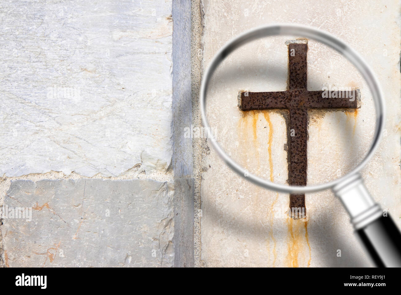 Looking for faith - concept image with a magnifying glass in front of a ...