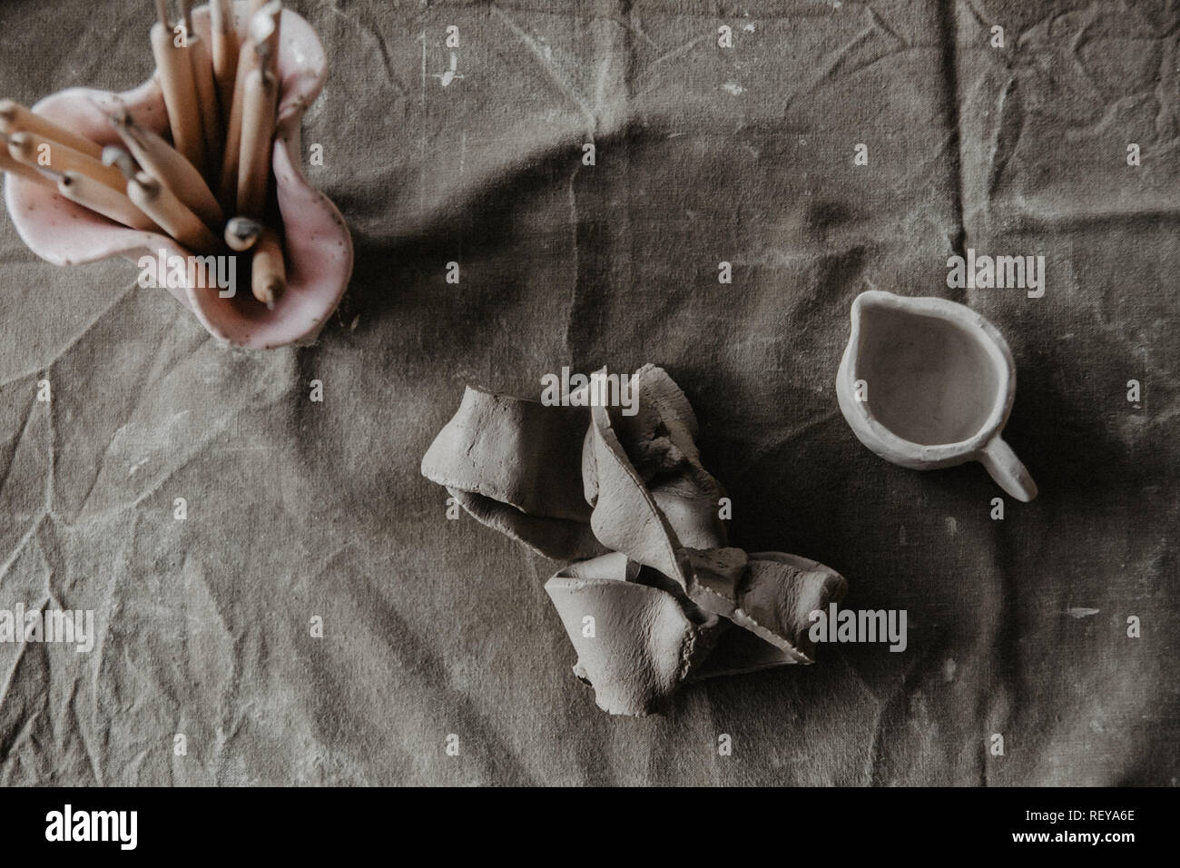 A piece of clay on table. Handmade craft background Stock Photo - Alamy