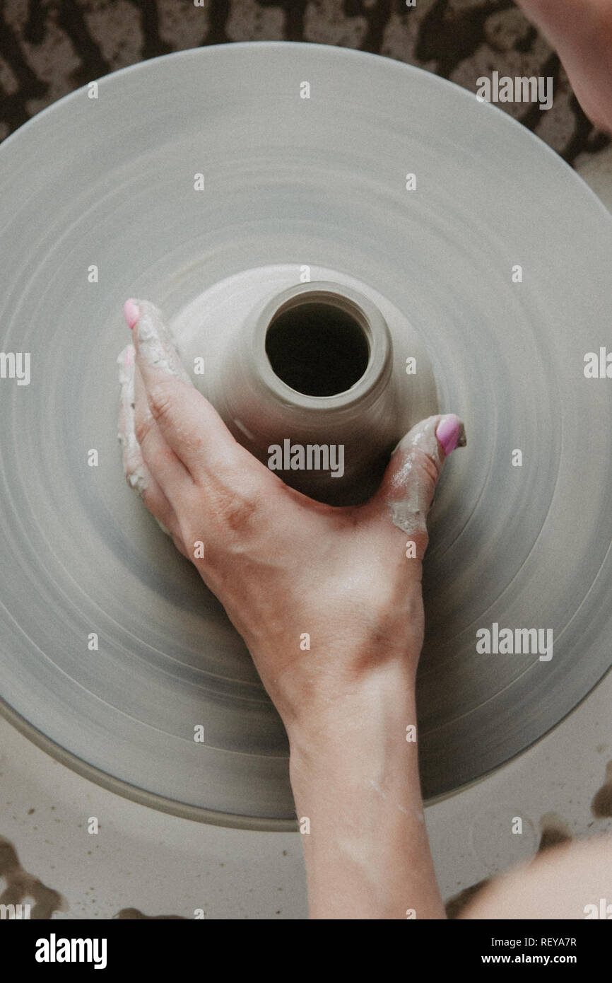 Top view of clay products, on a pottery wheel with copy space, closeup ...