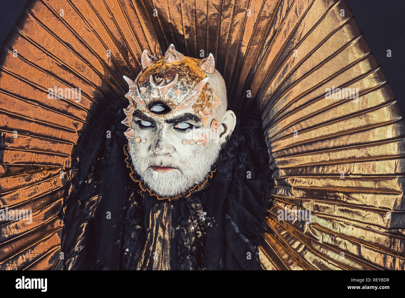 Man with third eye, thorns or warts. Senior man with white beard ...