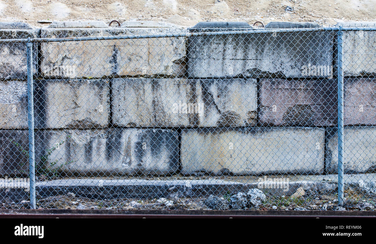 A fence and wall containing a pile of gypsum at Lafarge North America ...