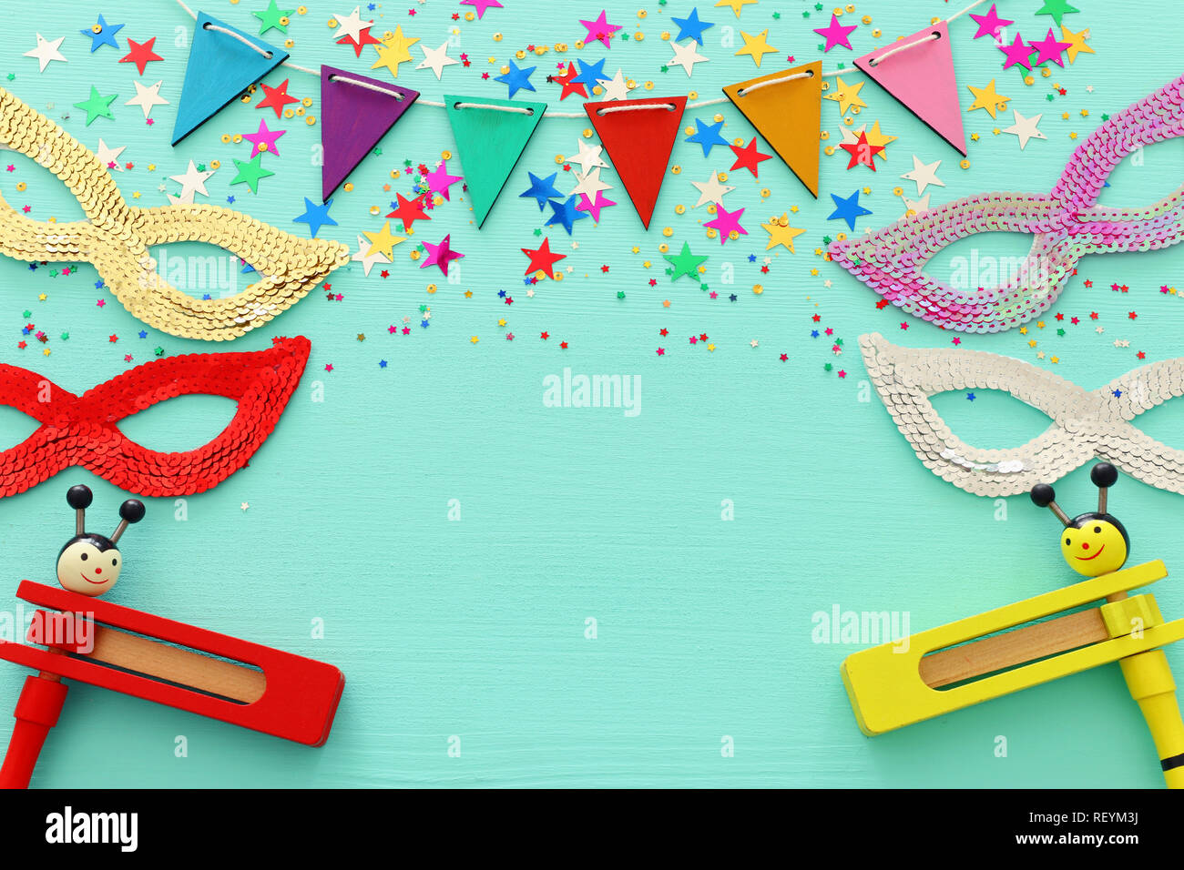 Purim celebration concept (jewish carnival holiday) over wooden blue ...