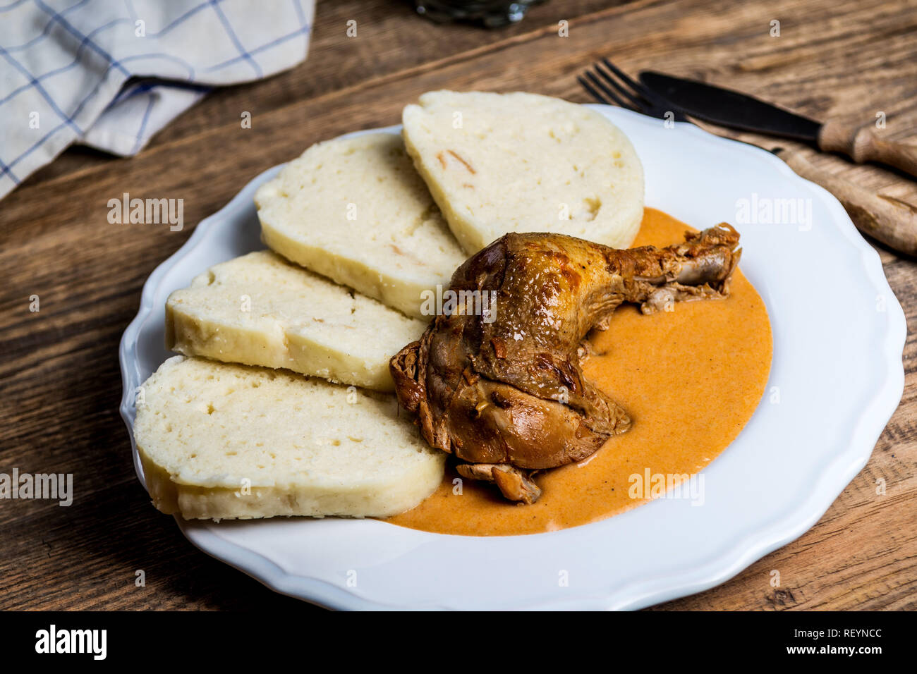 Traditional Czech cuisine chicken thigh on red pepper sauce with ...