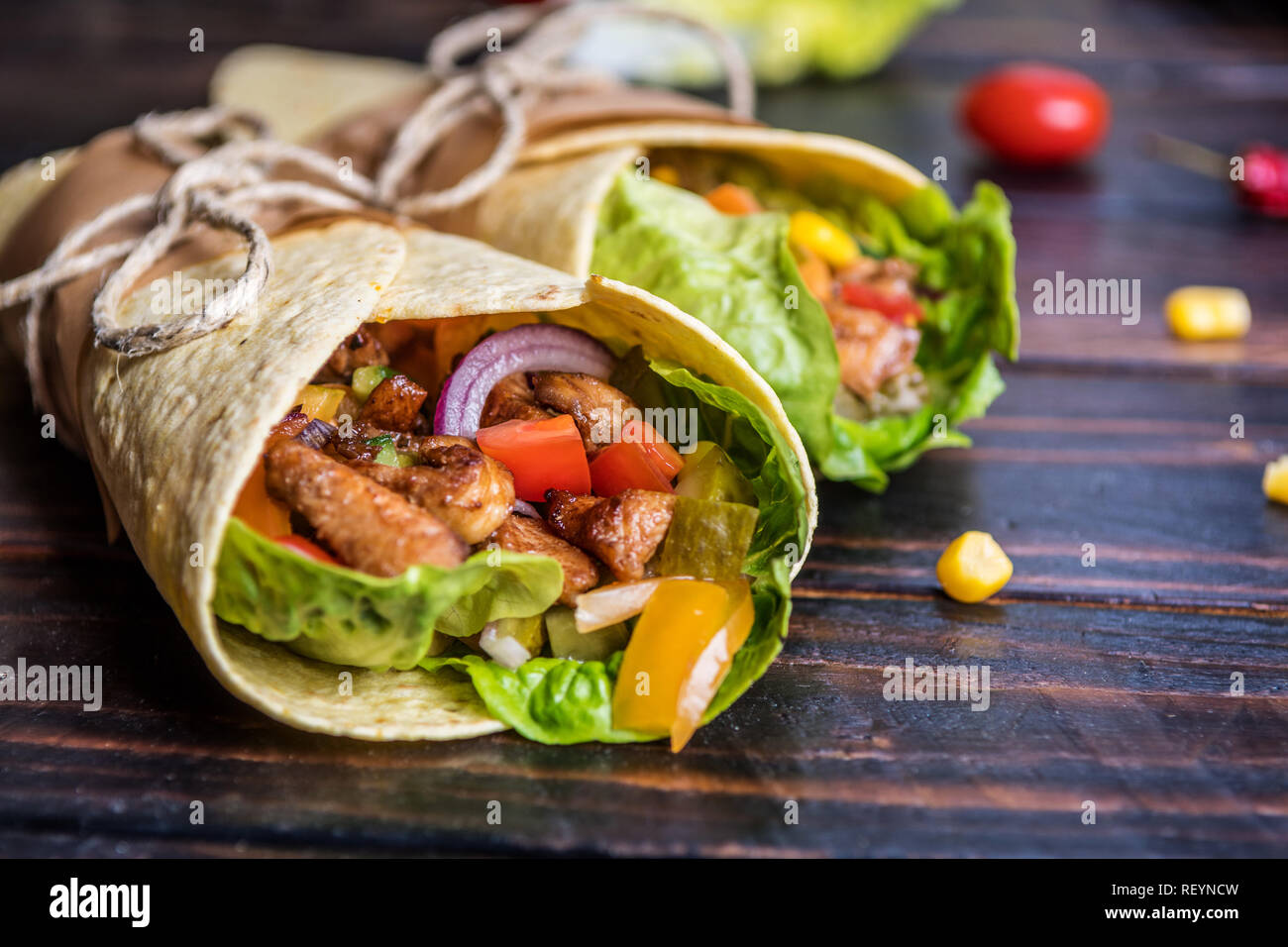 Traditional mexican tortilla wrap with vegetables and grilled chicken ...