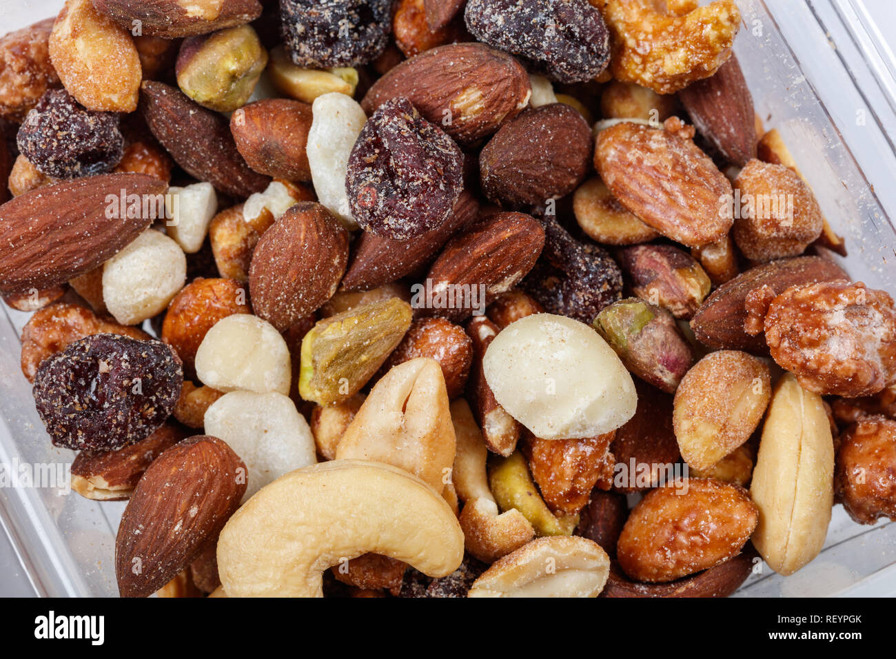 Mixed nuts snacks close up for background Stock Photo - Alamy